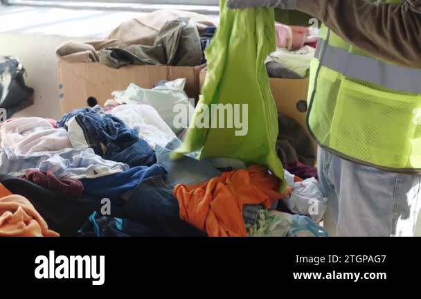 Textile recycling center. Sorting textiles into different fibres and ...