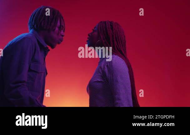 Problem relationship. Couple quarrel. Neon light portrait. Angry black ...