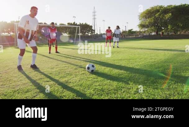 Video of diverse group of male football players on field, playing ...