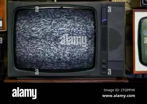 Old retro television with grey interference screen. Static noise of 80s ... Old retro television with grey interference screen. Static noise of 80s ...