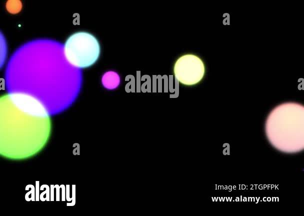 Colorful circle shape confetti flying with glowing bokeh light effect ...