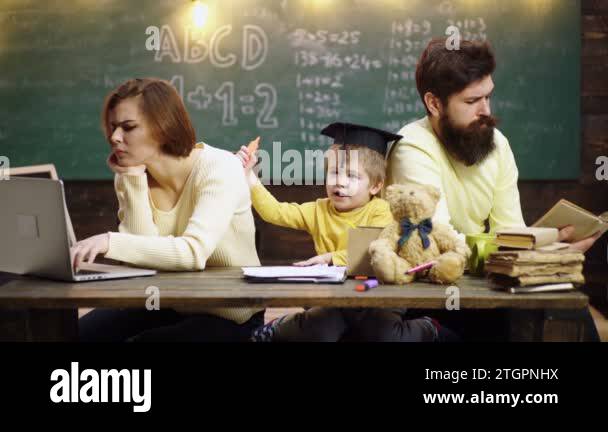 The family school. Family playing at home. Parents helping children ...