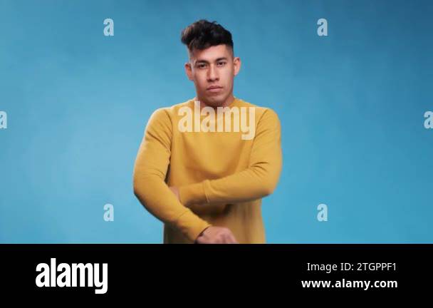 Serious and displeased man looking at camera and shakes head to ...