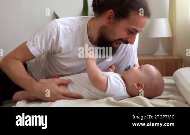 Authentic Bearded Long-haired Young Neo Father And Newborn Baby Looking ...