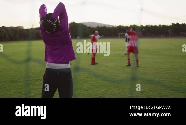 Video of diverse gorup of male football players on field,playing ...