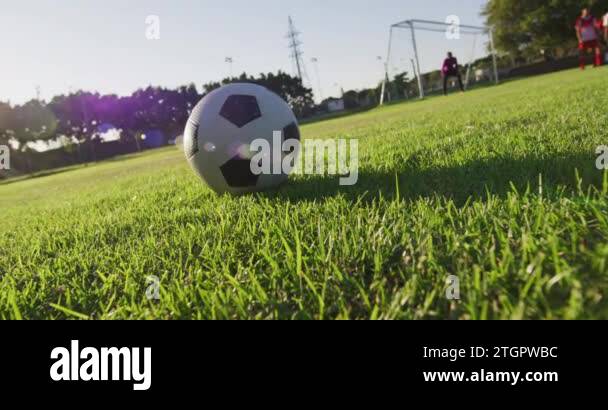 Video of diverse group of male football players playing football. Male ...