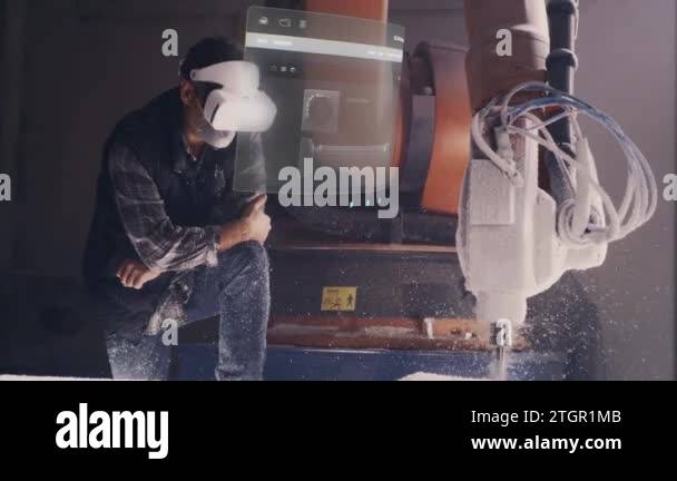 A worker in a vr headset watches the milling process, using augmented ...