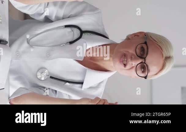 Vertical video. Wrong medicine. Angry woman. Doctor consultation ...