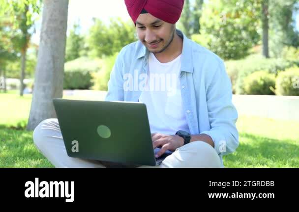 Male Indian student wearing red traditional national headdress turban ...