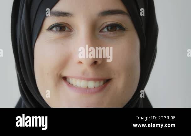 Extreme close-up female portrait indoors 20s smiling Arabian lady smile ...
