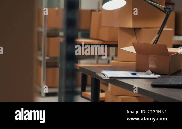 Warehouse filled with racks and shelves to put cardboard boxes ...