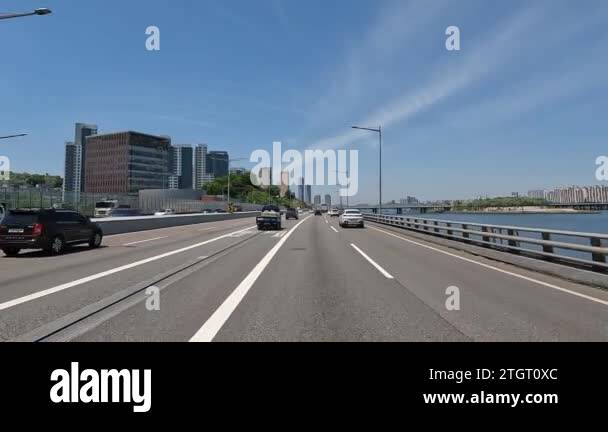 Vehicles Driving At Olympic-daero Highway Along The Han River In Seoul ...