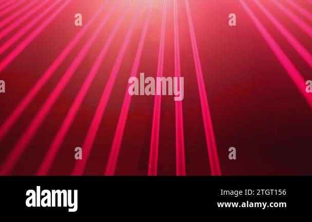 Laser beams fanning out from top to bottom,illuminate silhouettes of ...