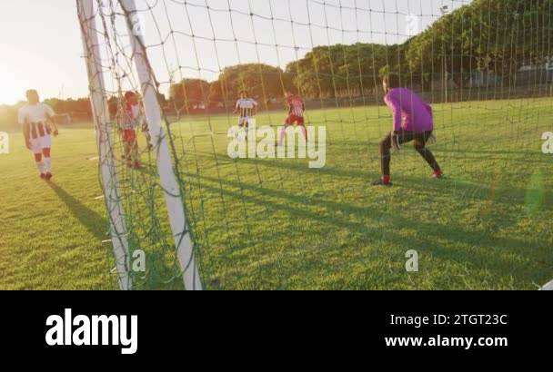 Video of diverse group of male football player on field, playing ...