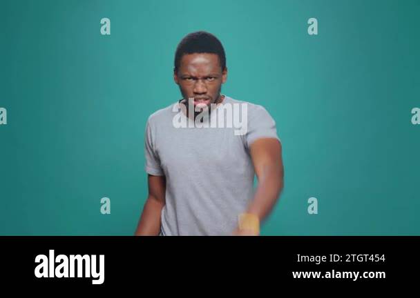 Violent furious man expressing anger and aggression in studio, having ...