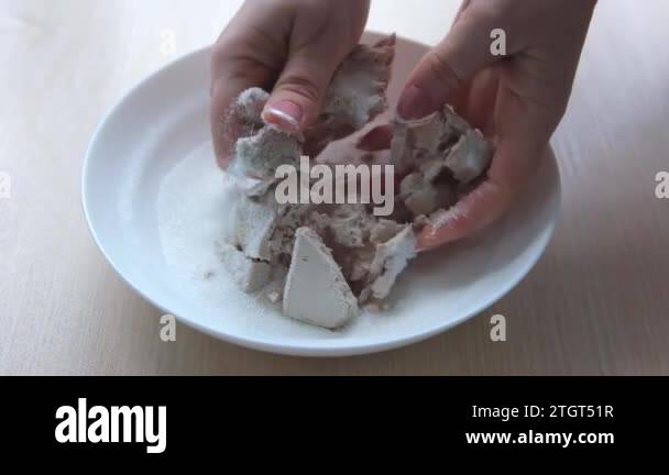 woman hands crushing fresh yeast and sugar delicious homemade yeast ...