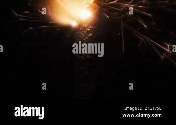 Sparkler on the black background in slow motion, macro shot. Lightening ...