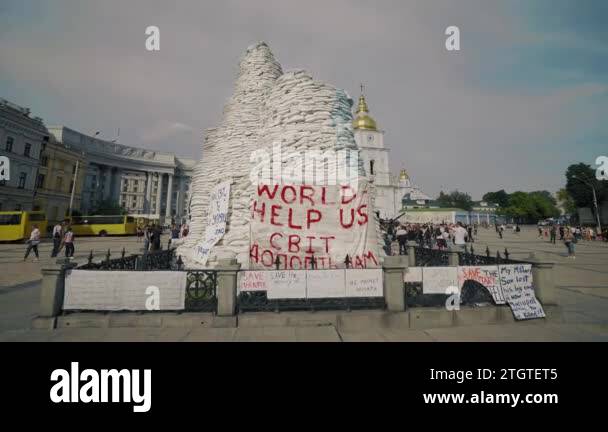 monuments protected by sandbags of Mikhailivska Square. Russian burned ...