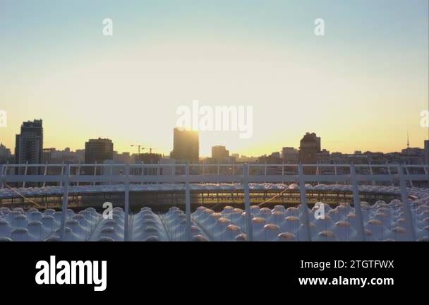 Landscape Of Stadium And City With Tall Buildings. Top View. Sun Behind ...
