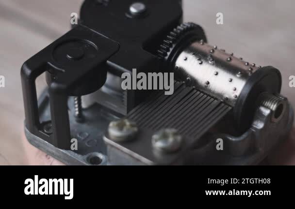 Music box mechanism close-up. Old music box clockwork device on ...