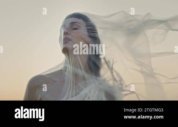 Beautiful Young Girl In Polyethylene Dress. Wind Blows Long Dress ...