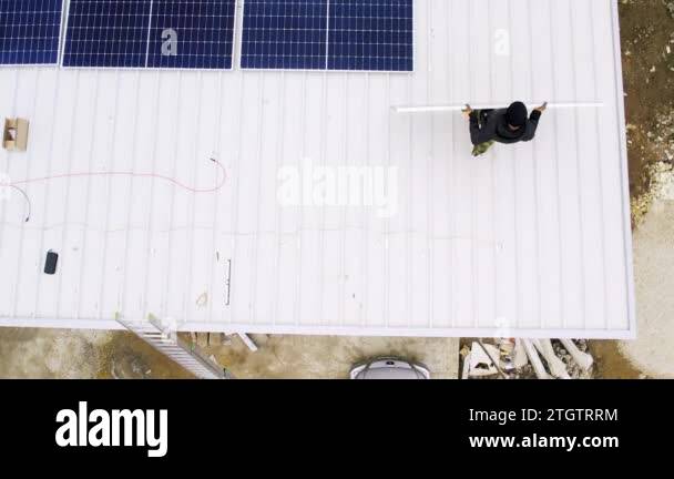 Solar technician installing solar panels on house roof. Concept.renewable energy, technology ...