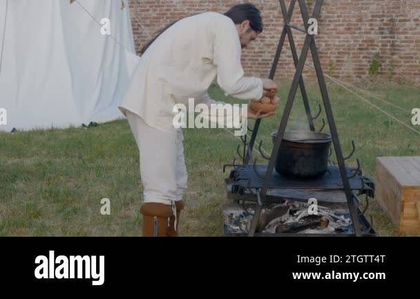 Scenes in medieval costume, a priest smiling at the Trecentesca ...