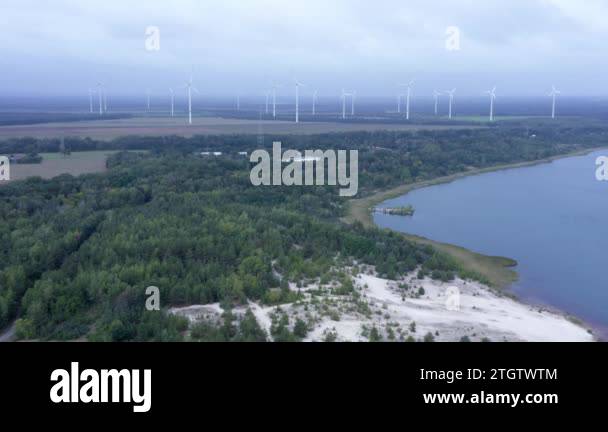 Wind energy. A large group of windmills to create renewable energy by ...