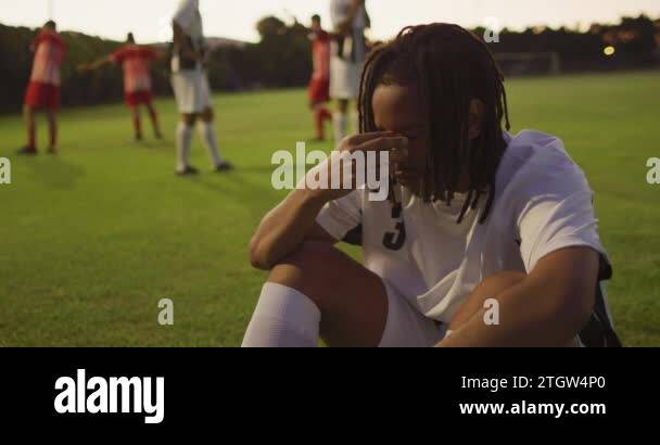 Video of mad african american football player siting on field. Male ...
