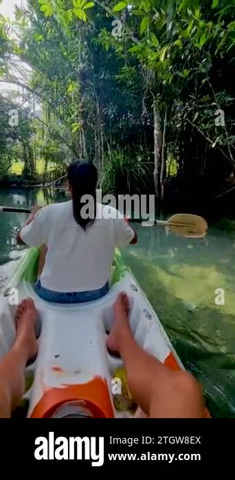 couple in a kayak in the jungle of Krabi Thailand, men and woman in ...