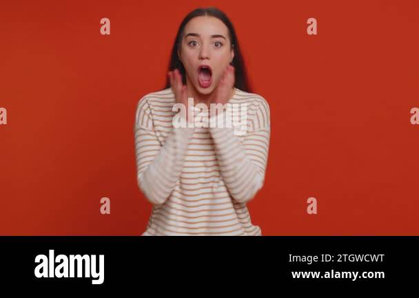 Oh my God, Wow. Excited amazed winner woman raising hands in surprise ...