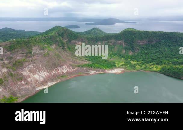 The smallest volcano in the Philippines is Taal with a green crater ...