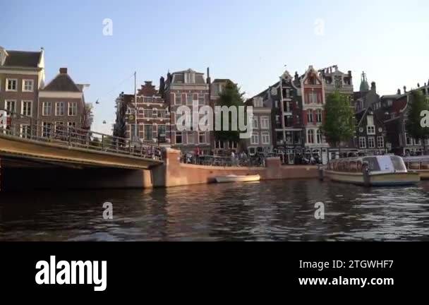 Amsterdam, view of city from river, camera floats under bridge ...