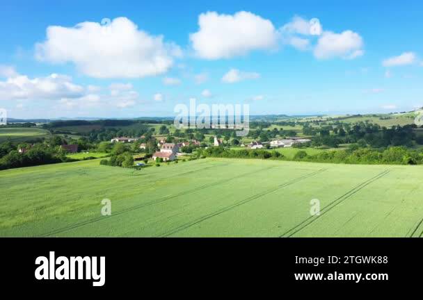 A traditional French village in the middle of fields and forests , in ...