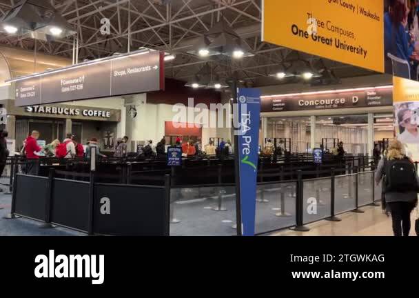 A view of passengers lined up at TSA checkpoint in General Mitchell ...