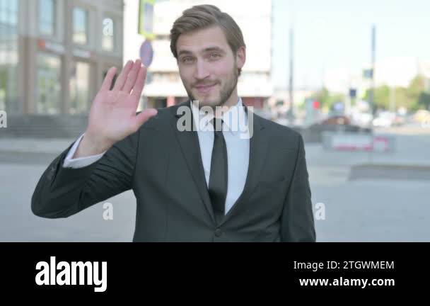 Welcoming middle aged businessman waving Stock Videos & Footage - HD ...