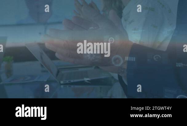 Animation of digital screens with data moving over hands of ...