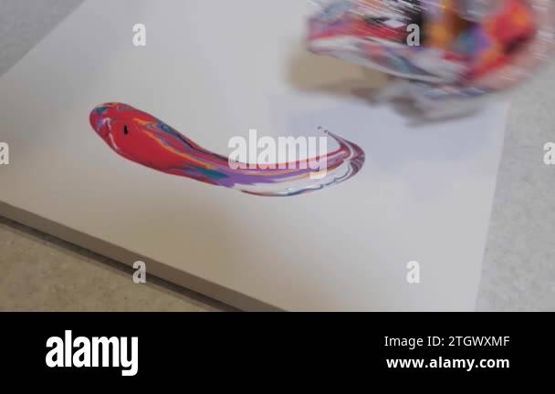Painting with liquid ink. Abstract ink painting. The artist creates a ...