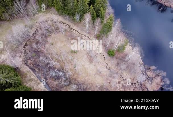 Top down video of mainland and water texture. Tilting up with the ...