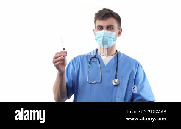Medic doctor chemist with a stethoscope in uniform points a finger at a ...