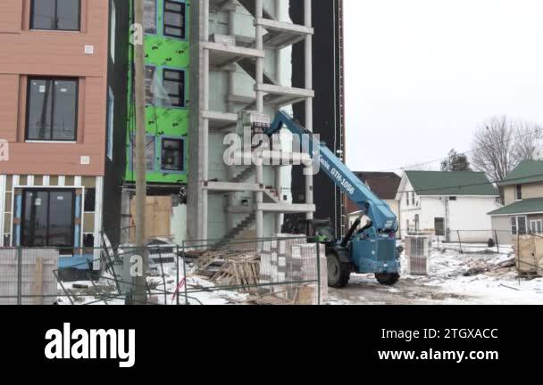 A footage of heavy lifting Telescopic forklift operating in ...