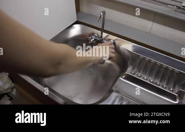 Opening an indoor kitchen water faucet in a motorhome. Opening a water ...