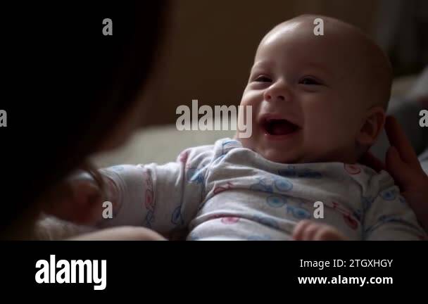 Newborn Baby With Young Mom look Into Each Other Eye. Cute Smiling ...