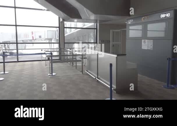 Panning to empty airport terminal waiting area.No people in lounge at ...