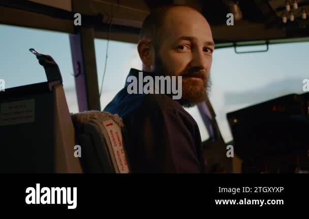 Portrait of aviation captain using control panel command to takeoff and ...