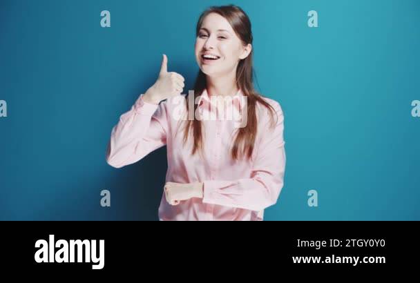 Woman shows success hand sign Stock Video Footage - Alamy