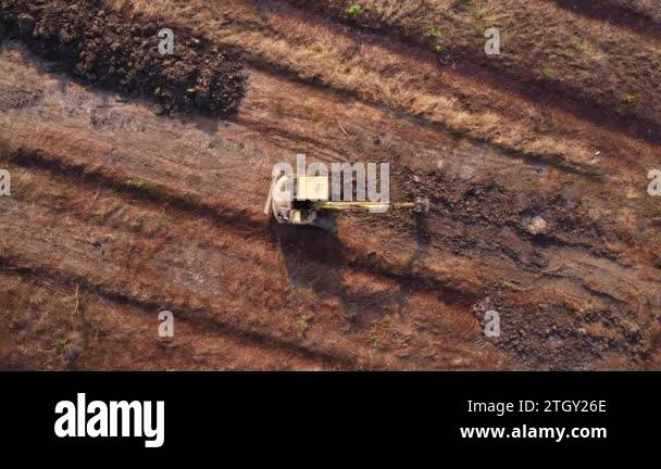Excavator dig ground at construction site. Aerial view of a wheel ...