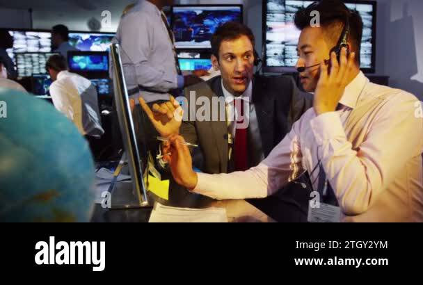 surveillance team working in control room Stock Video Footage - Alamy