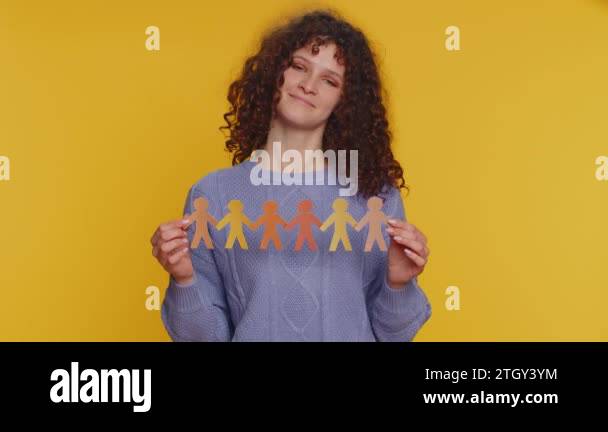 Woman showing multiracial different skin color human shape cut out of ...
