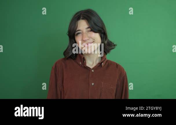 Beautiful girl blinking one eye, using her face in meaningful messages ...